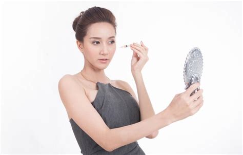 Premium Photo Woman Injecting Syringe On Cheek Against White Background