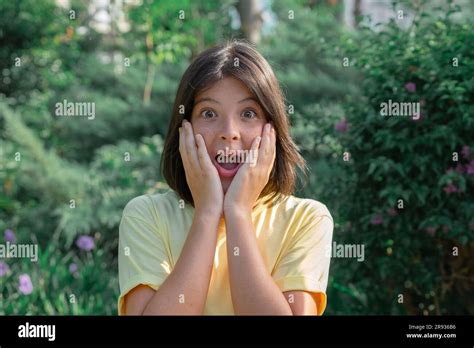 Frightened Young Girl With Wide Open Eyes The Girl Covered Her Face