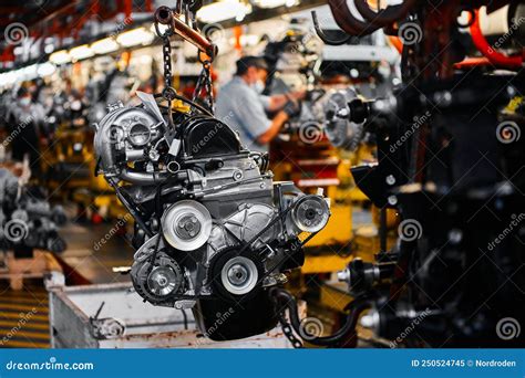 Car Motor Hangs On Chains In Assembling Plant Workshop Stock Image Image Of Engineering