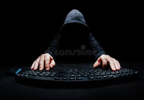 Evil Hacker Man Anonymous In Hoodie Behind The Keyboard Smoke Instead Of Face Stock Image