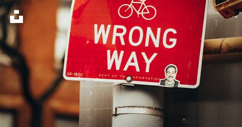 A Red Wrong Way Sign On A Pole Photo Free Sign Image On Unsplash
