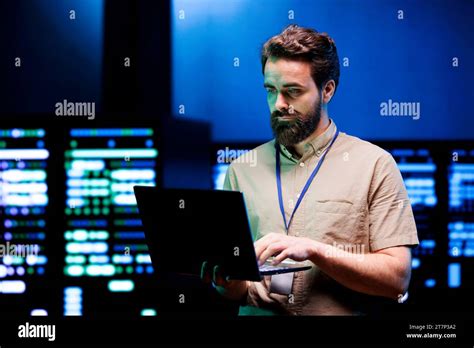 Specialist Doing Maintenance In Server Farm Providing Secure Scalable And Failsafe