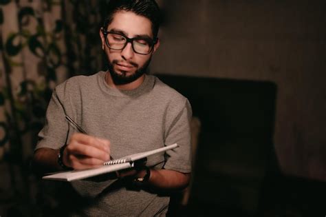 Premium Photo Man Writing On Notepad With Copyspace