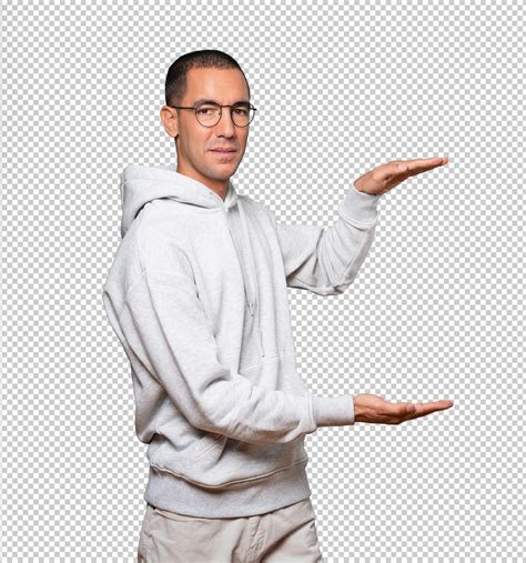 Premium Psd Confident Young Man Doing A Gesture Of Holding Something