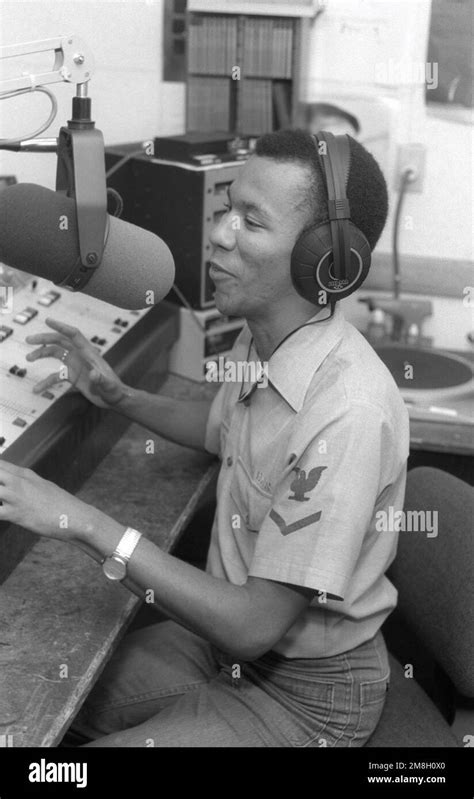 Journalist 3rd Class Tony Jordan Operates A Radio Board For The Navy Broadcasting Service