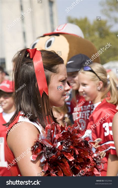Ohio State University Cheerleader With Brutus The Buckeye In The Back