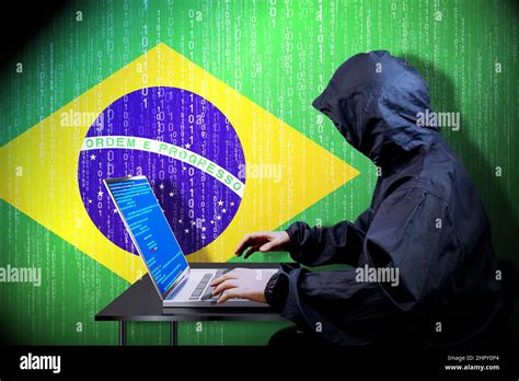 anonymous hooded hacker flag of brazil binary code cyber attack