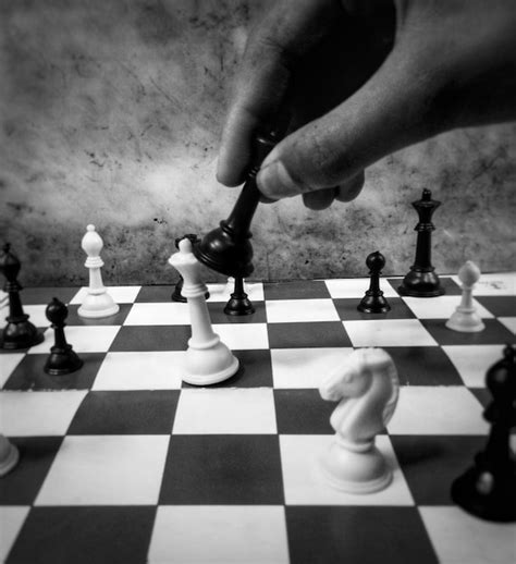 Premium Photo Cropped Hand Of Person Playing Chess