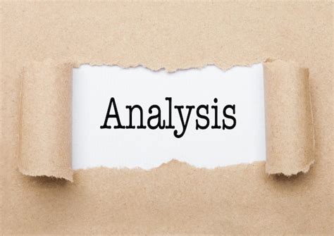Premium Photo Analysis Concept Text Appearing Behind Torn Brown Paper