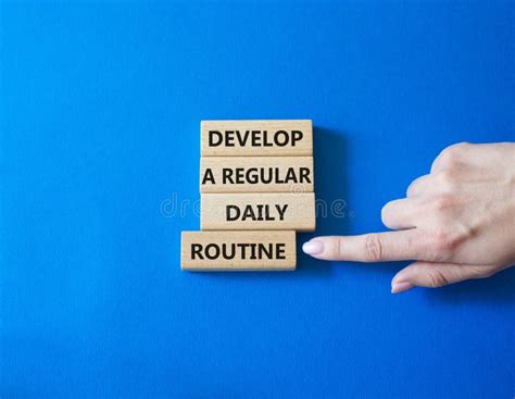 Develop A Regular Daily Routine Symbol Concept Words Develop A Regular Daily Routine On Wooden