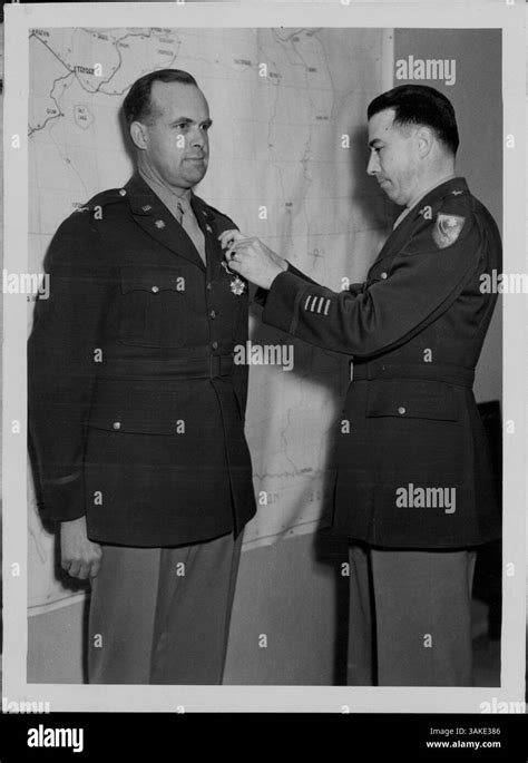 Brigadier General Donald P Booth Pins The Legion Of Merit On Colonel