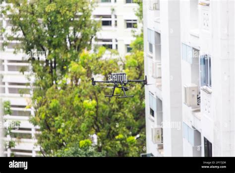 A Drone In Mid Air Flight Is Conducting A Building Inspection To Identify Any Critical Defects