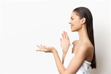 Premium Photo Young Woman Showcasing Skincare Routine Smiling Side