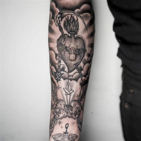 A Mans Arm With Tattoos On It And An Image Of A Heart In The Sky