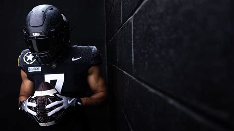 The All Black Uniforms Reflect The Snow Covered Forests Where The