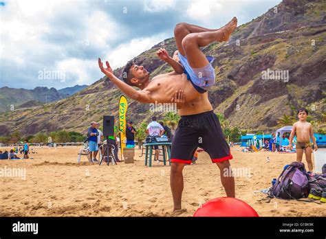 Public Exhibition Of Martial Arts Tricking Sports On The Beach Stock