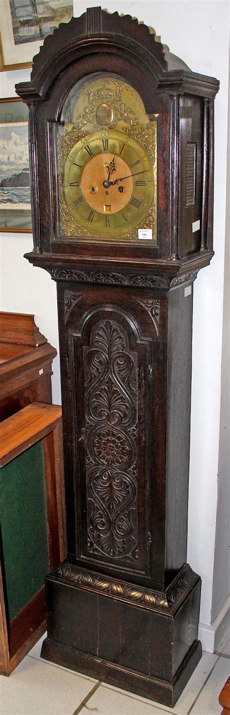 Bonhams A Carved Oak Longcase Clock