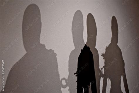 Human Shadows On The Wall Illumination By Different Intensity Lamps