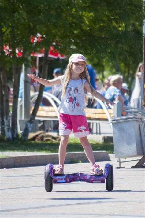 The Russian Girl Rides A Giroskuter In The Summer On The Square Editorial Photography Image