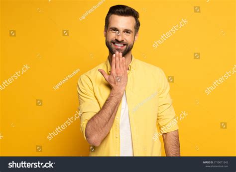 Smiling Man Looking Camera While Showing Stock Photo Shutterstock