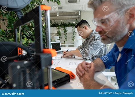 Architects Working With 3D Printer And Projecting House Model Drawing
