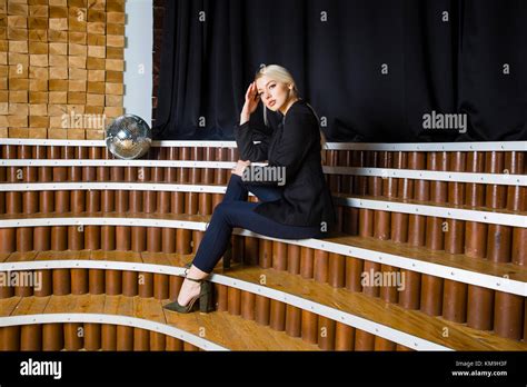 Beautiful Blonde Businesswoman With Puffy Lips At Loft Office In Suit