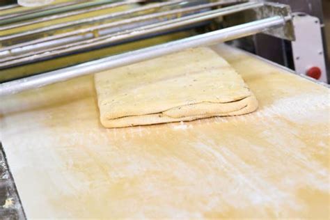 Cracker Dough Sheeting Process Results In Even Thickness Before Cutting