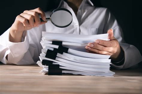 Premium Photo Business Woman Holding Magnifying Glass And Documents