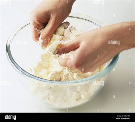 Making Shortcrust Pastry Rubbing Butter Into Flour In A Bowl Stock