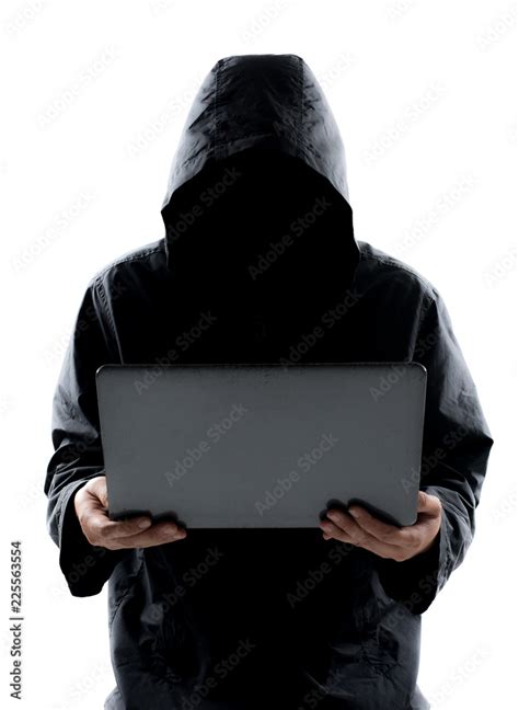 Hacker With Hidden Face In A Hoodie Using A Laptop Isolated On White