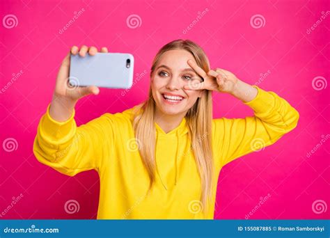 Photo Of Pretty Lady Making Selfies Showing V Sign Near Eye Wear Yellow