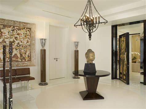 Modern Neutral Foyer With Buddha Head Statue Luxe Interiors Design