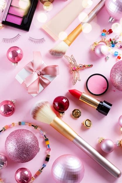 Premium Photo Festive Make Up Brushes And Products On Pink Background