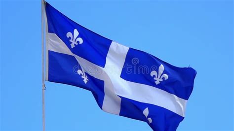 The Blue And White Flag Of Quebec Featuring Fleur De Lis Proudly