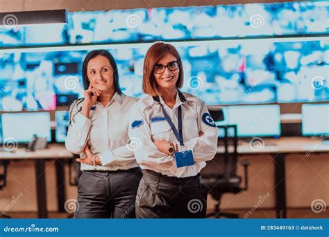 Group Portrait Of Female Security Operator While Working In A Data System Control Room Offices