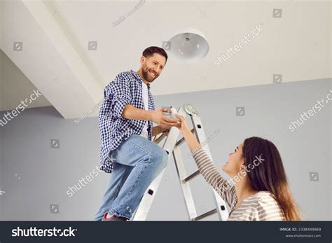 Smiling Man Changing New Electric Bulb Stock Photo 2338449969 Shutterstock