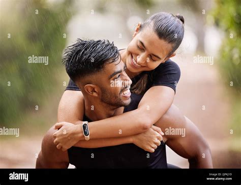 Wet Fitness Couple Playing In The Rain During Fun Romantic Outdoor