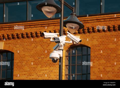 Multiple Surveillance Cameras On Metal Pole Urban Residential Neighborhood Safety Monitoring