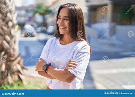 Young Beautiful Hispanic Woman Standing With Arms Crossed Gesture At