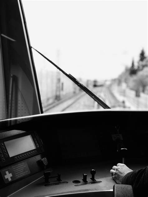 Person Inside Train Cockpit Photo Free White Image On Unsplash