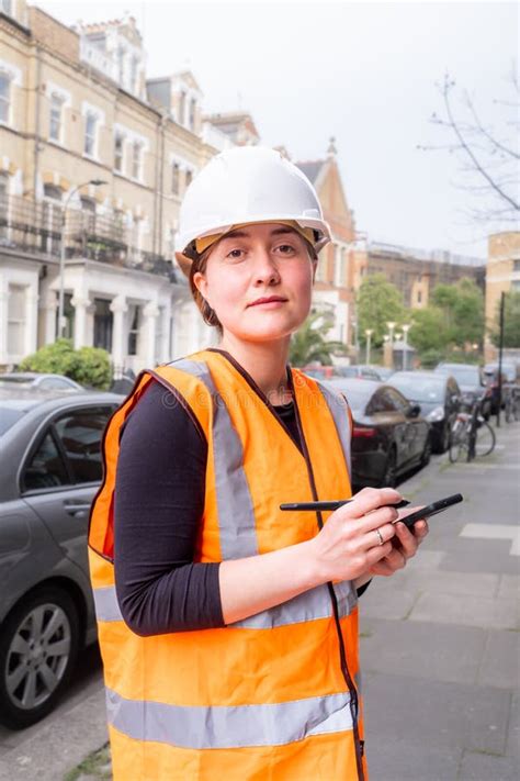 Chartered Civil Engineer Lady Writing On A Smart Phone With An