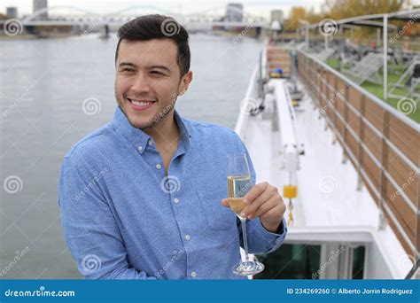 Upper Class Elegant Ethnic Man Drinking Champagne In Private Yacht