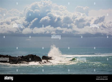 Dramatic Cumulonimbus Storm Cloud Over The Ocean Raining In Distance