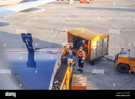 Moscow, Russia 31.03.2022. airport employees unload suitcases ...
