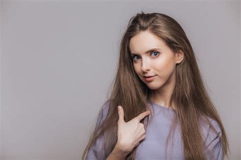Premium Photo Surprised Pretty Woman Long Dark Hair Blue Eyes
