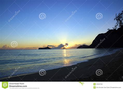 Early Morning Sunrise On Waimanalo Beach Over Rock Island Bursting