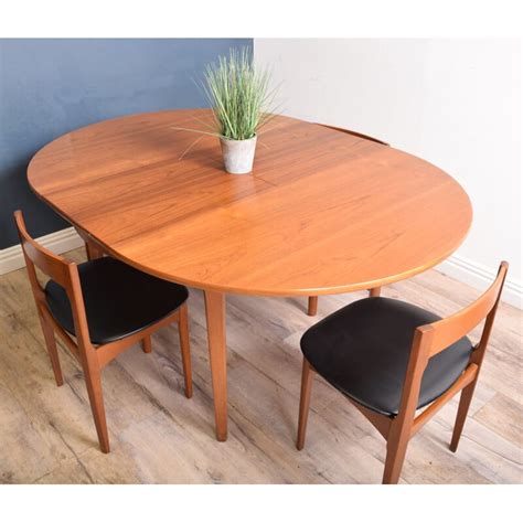 Vintage Teak Round Nathan Table And Four Tuck Under Chairs 1960s