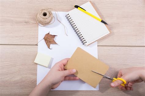 Premium Photo Cropped Hand Making Origami On Table