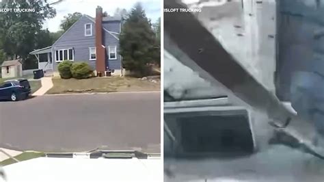 Dump Truck Crashes Through Suburban House On Video Injuring Resident