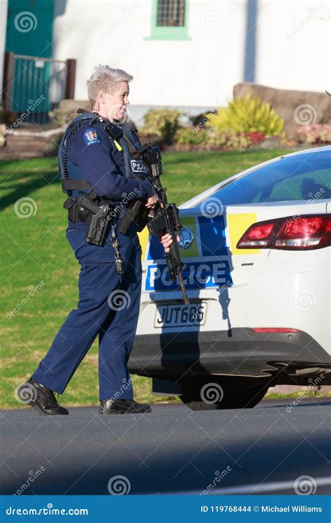 A Female Member Of The New Zealand Police Armed With An Assault Rifle